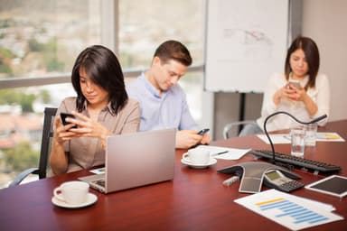 Employees Waste Time Using Cell Phones at Work